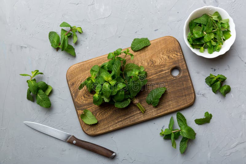 Fresh Mint on Cutting Board Table, Top View. Flat Lay Space for Text ...