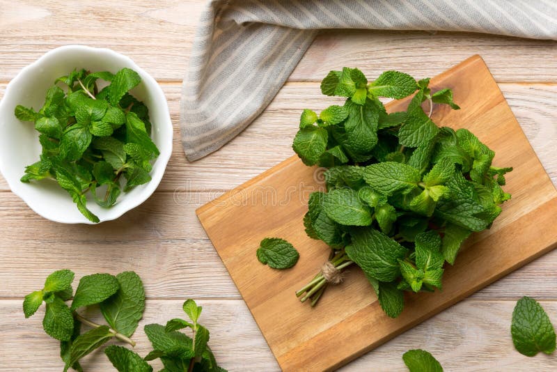 Fresh Mint on Cutting Board Table, Top View. Flat Lay Space for Text ...