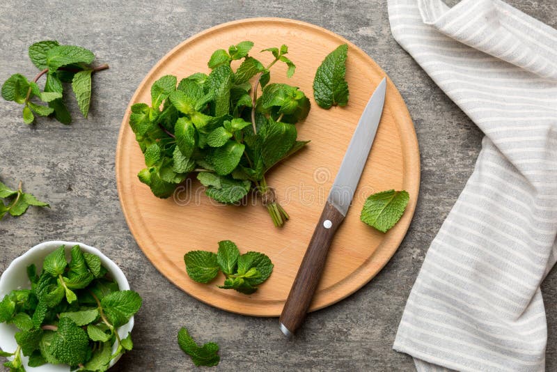 Fresh Mint on Cutting Board Table, Top View. Flat Lay Space for Text ...