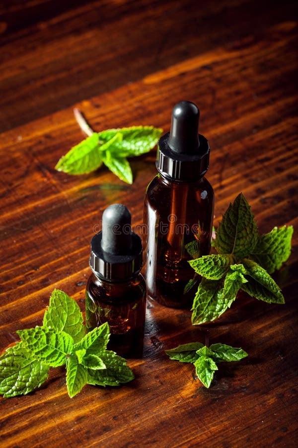 Fresh Mint Leaves, Essential Oil on Wooden Table Stock Photo - Image of ...