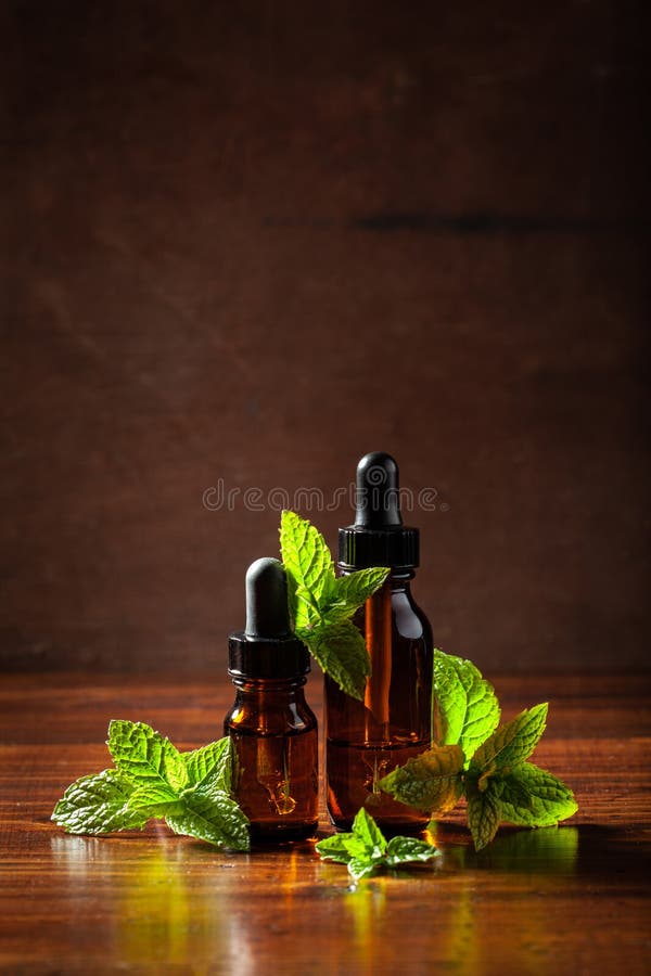 Fresh Mint Peppermint Herb Leaves and Essential Oil in Dropper Bottles ...