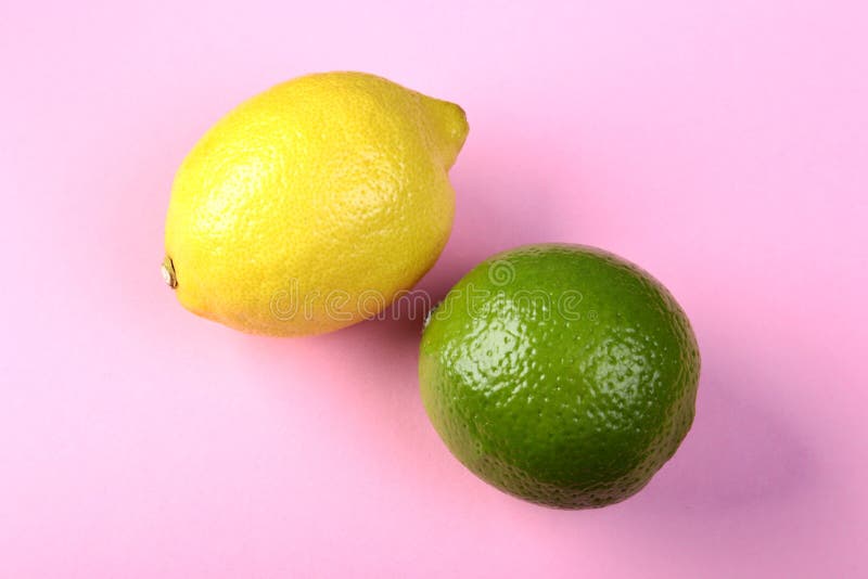 Fresh Mixed Exotic Fruits Lemon and Lime on a Pink Background. Fruit ...