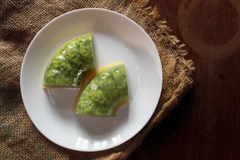 Fresh Moss Green Pudding Dessert on White Plate Over Burlap Background ...