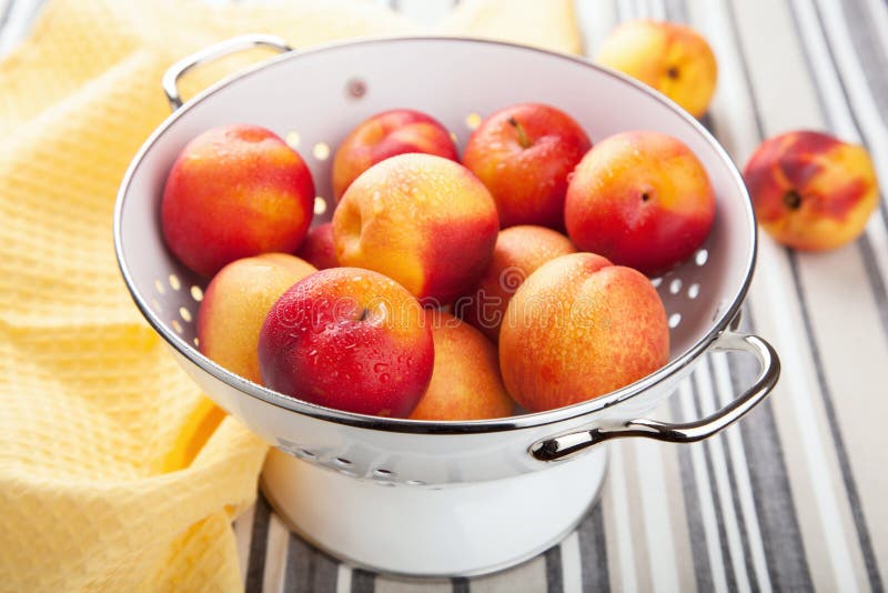 Fresh Nectarines and Plums in Colander Stock Photo - Image of health ...