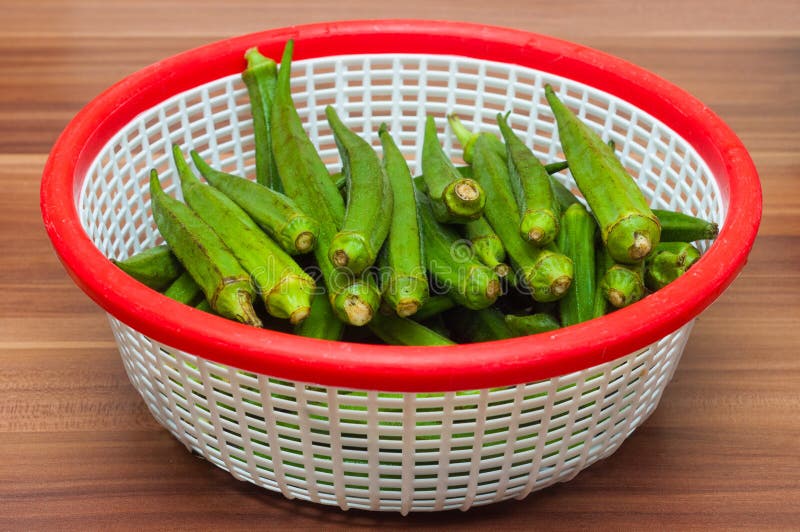 Okra or Bhindi, Bamia Stacked in a Basket on Wood Background Stock ...