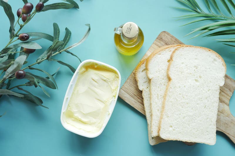 Fresh Olive Butter in a Container with Bread on Table Stock Photo ...