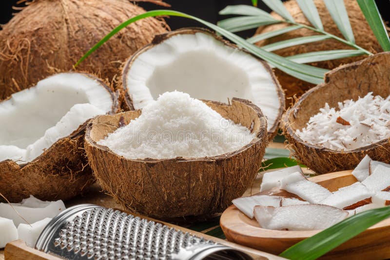 Fresh Opened Coconuts Along with Coconut Slices, Flakes and Coconut ...