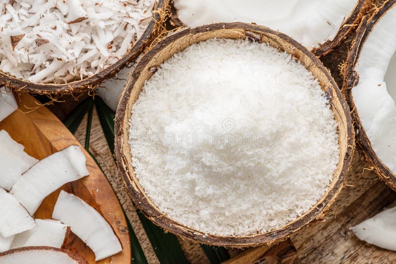 Fresh Opened Coconuts Along with Coconut Slices, Flakes and Coconut ...