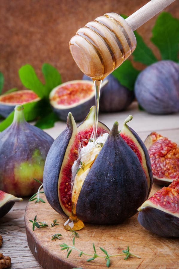 Fresh Opened Figs with Cheese and Honey on Wooden Table. Stock Photo ...