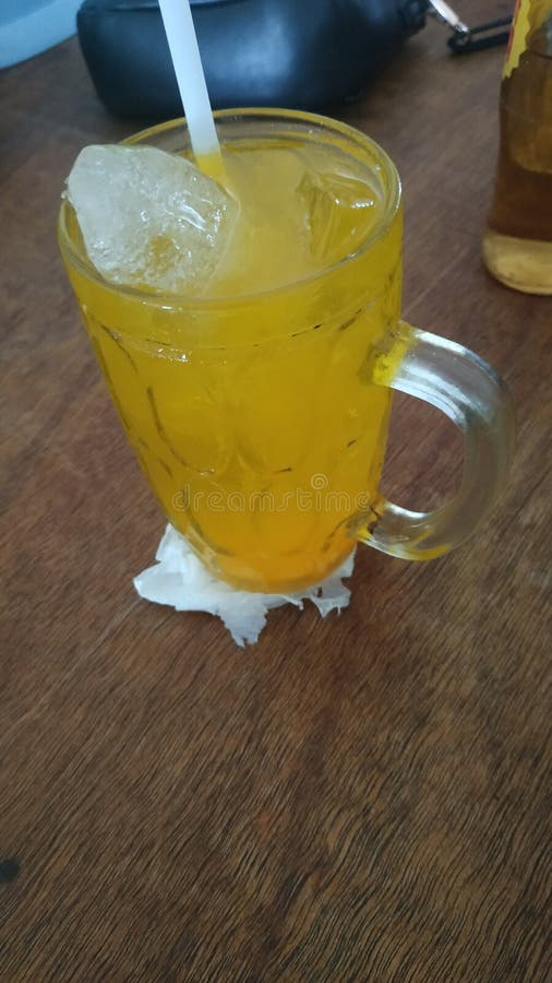 Fresh Orange Cold Drink in a Glass Located on the Dining Table Stock ...