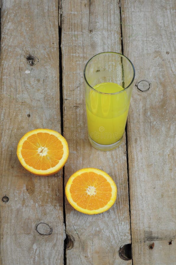 Fresh Orange Juice and Two Halves of a Fruit Stock Photo - Image of ...