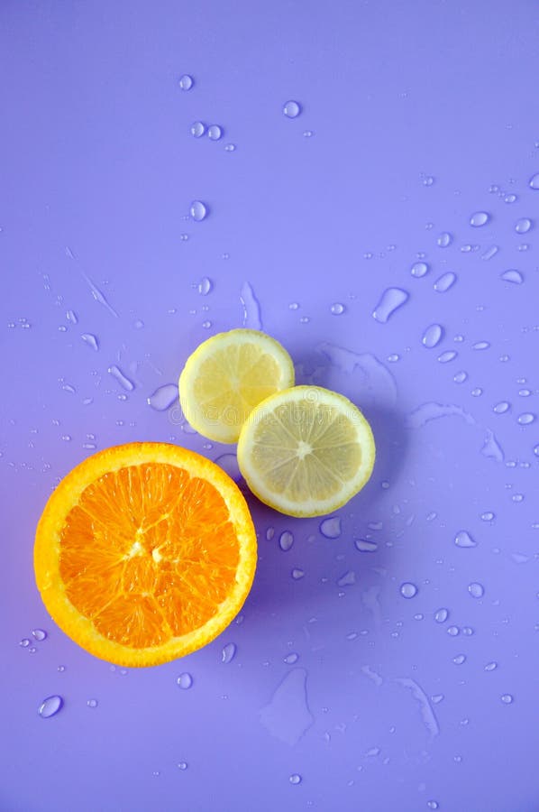 Fresh Orange and Lemon Pieces on Blue Background Stock Photo - Image of ...