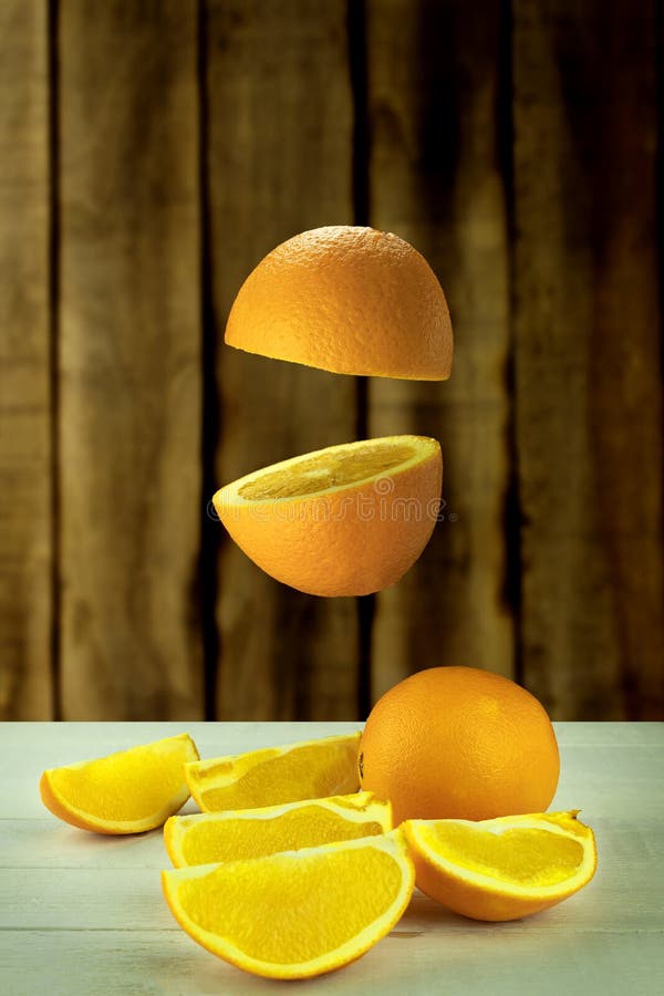Fresh orange and orange slices on wood light background, Fresh orange ...