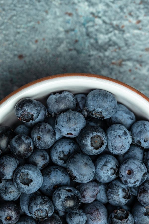 Fresh Organic Blueberries in Bowl Background, Vertical Image. Top View ...
