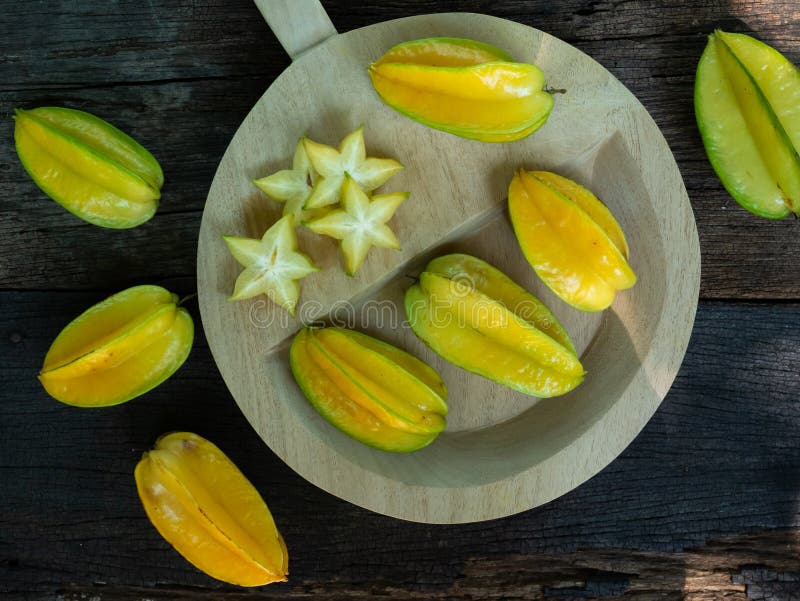 Fresh Organic Cut Star Fruit on Wooden Chopping Board Stock Image ...