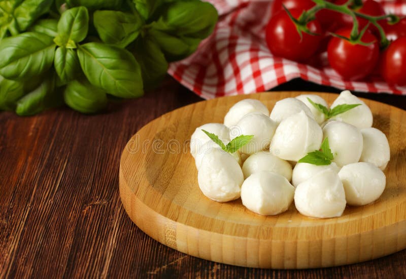 Mini Mozzarella Balls with Basil Leaf Isolated on White Background. Top ...