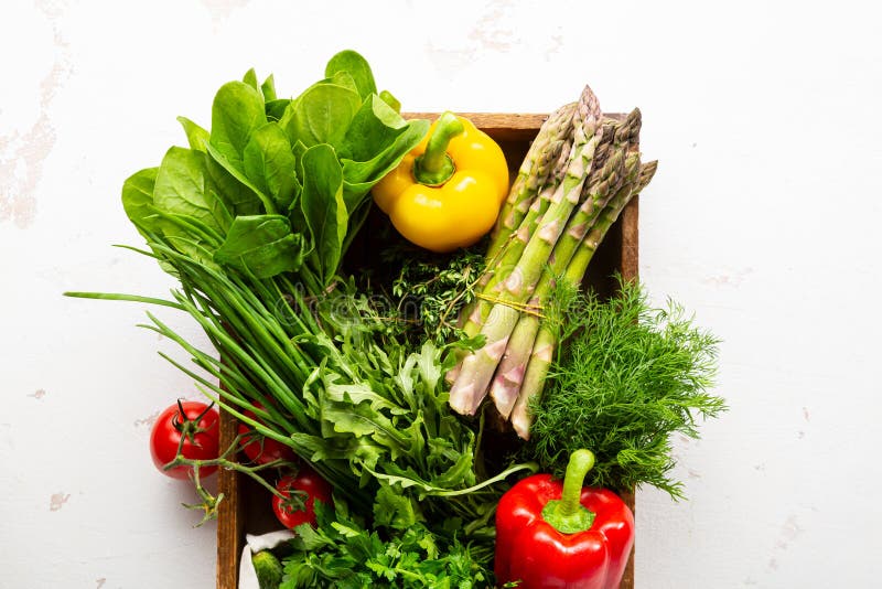 Fresh Organic Raw Produce in Crate, Top View on Light Surface Stock ...