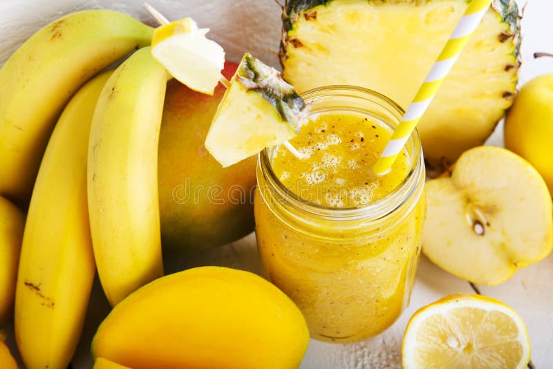 Organic Yellow Smoothie with Banana, Apple, Mango, Pear, Pineapp Stock ...