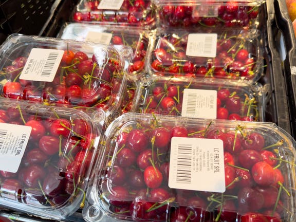 Fresh Packaged Red Cherries Displayed in Grocery Store Editorial Stock ...