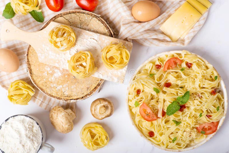 Fresh Pasta and Pasta Machine on Kitchen Table Stock Photo - Image of ...