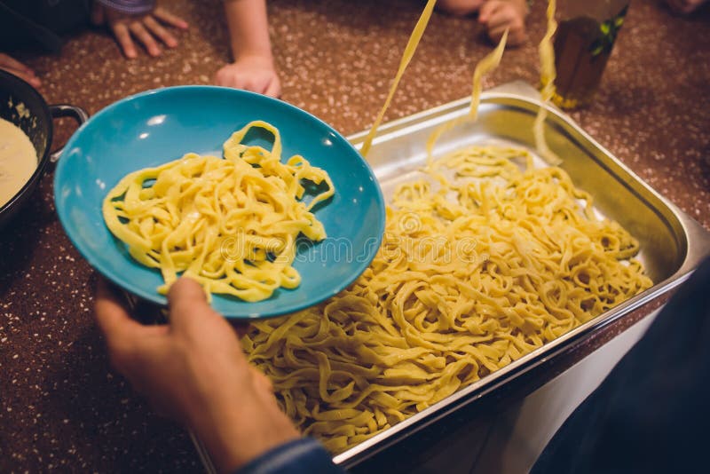 Fresh Pasta and Pasta Machine on Kitchen Table. Stock Photo - Image of ...
