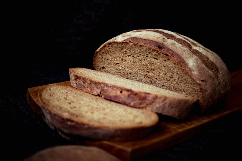 Round Bread, Lying on a Brown, Wooden Board Stock Image - Image of ...