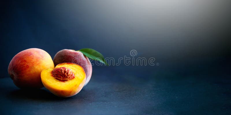 Fresh Peaches and Split with Leaves on Black Background. Banner Concept ...
