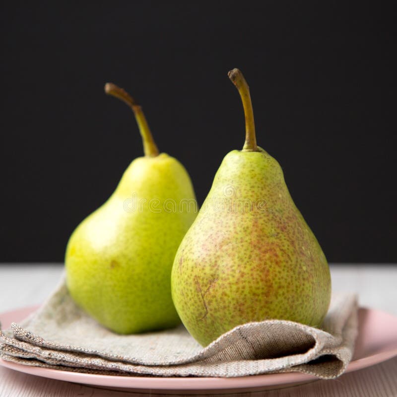 Fresh Pears on Pink Plate, Side View. Closeup Stock Image - Image of ...