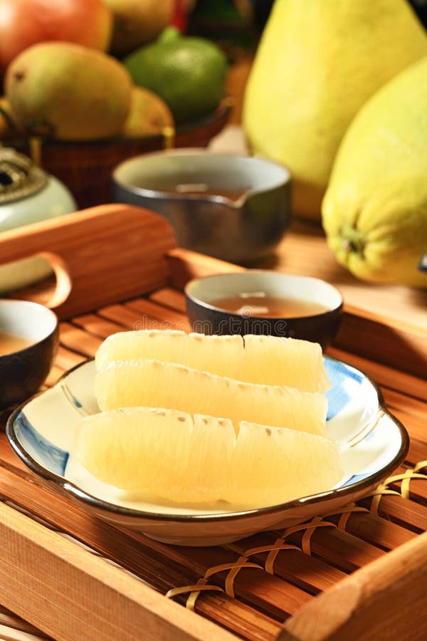 Row of Peeled Pomelo Segments with Opened in Half and Whole Fruit in ...