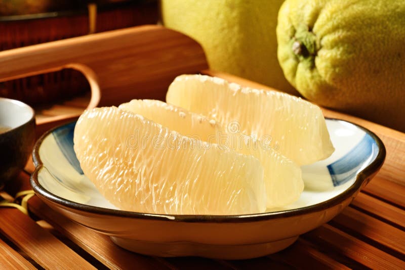 Row of Peeled Pomelo Segments with Opened in Half and Whole Fruit in ...