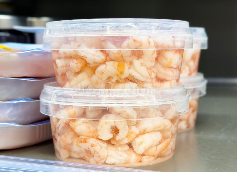 Fresh Peeled Shrimp in Plastic Containers Stacked in Refrigerator ...