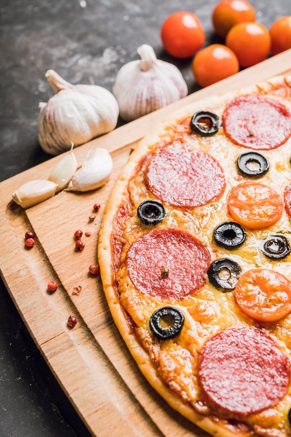 Fresh Pepperoni Pizza Served on the Rustic Background Stock Image ...