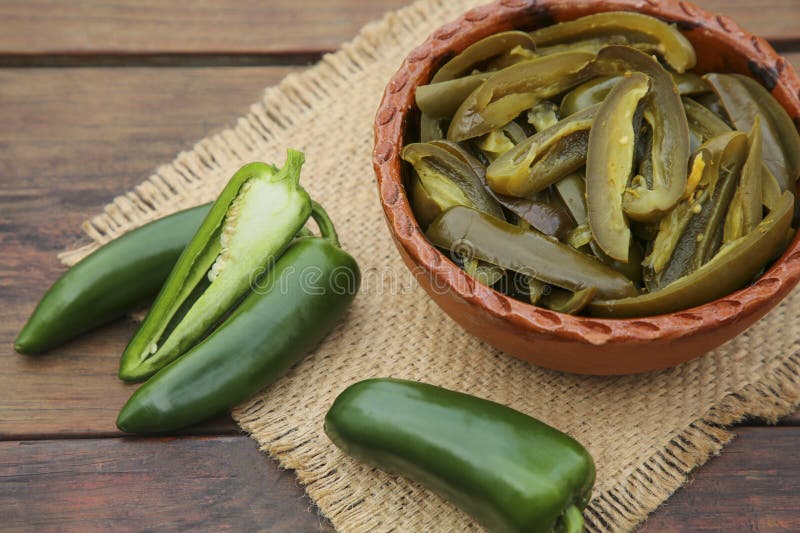 Fresh and Pickled Green Jalapeno Peppers on Wooden Table Stock Image ... Fresh and Pickled Green Jalapeno Peppers on Wooden Table Stock Image ...
