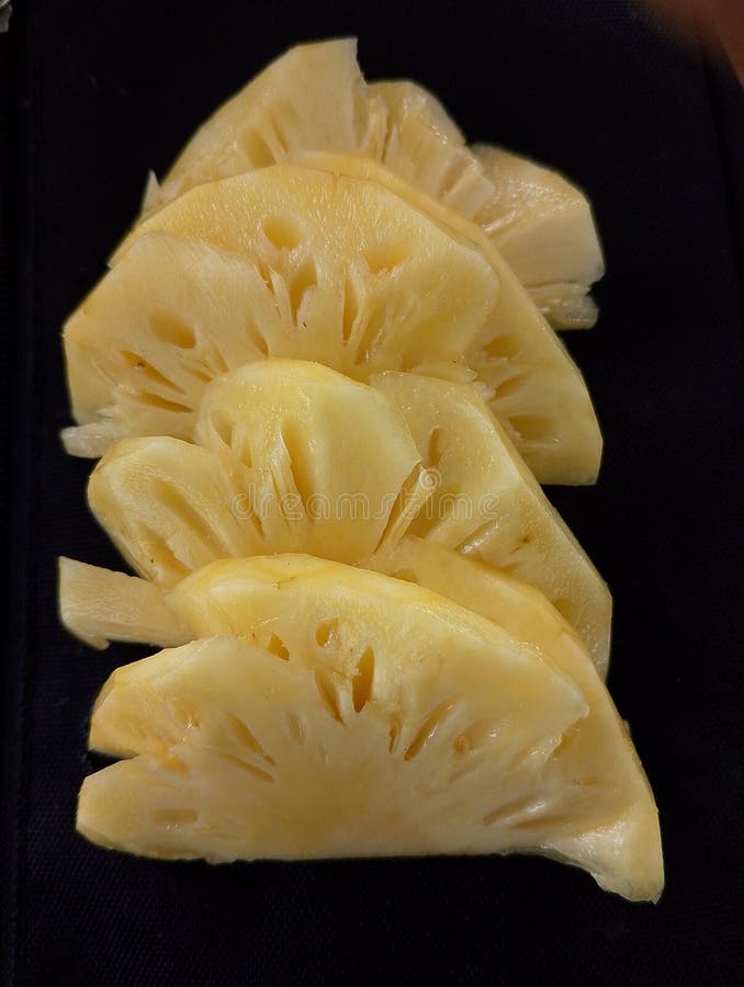 A Fresh Pineapple Slices on Black Background Stock Photo - Image of ...