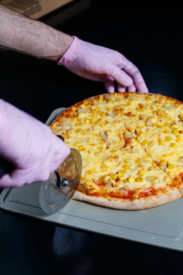 Fresh Pizza with Cheese it is Cut with a Pizza Cutter, Freshly Baked ...