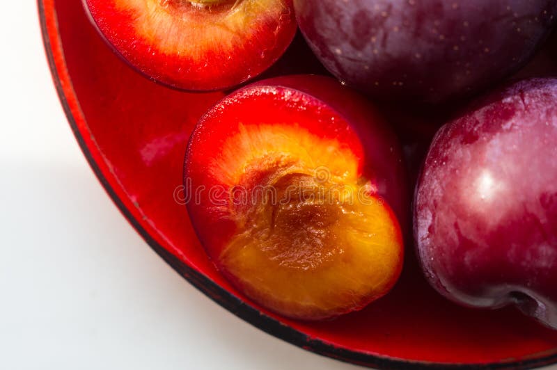 Fresh Plum Fruit in the Red Saucer on White Background Stock Image ... Fresh Plum Fruit in the Red Saucer on White Background Stock Image ...
