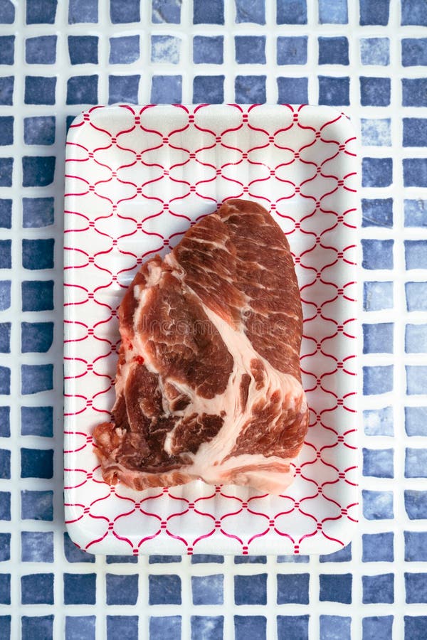 Fresh Pork Neck Meat in Packaging Tray on Blue Tile Table Stock Image ...
