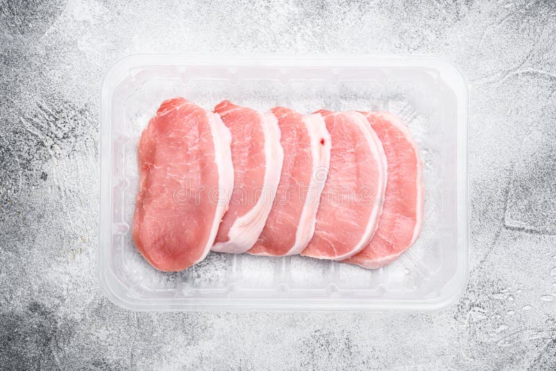 Fresh Pork, in Plastic Pack Container, on Gray Stone Table Background ...