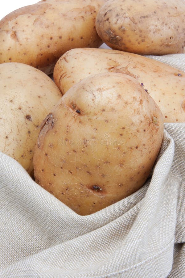Overflowing bag of potatos stock image. Image of starch - 1019129