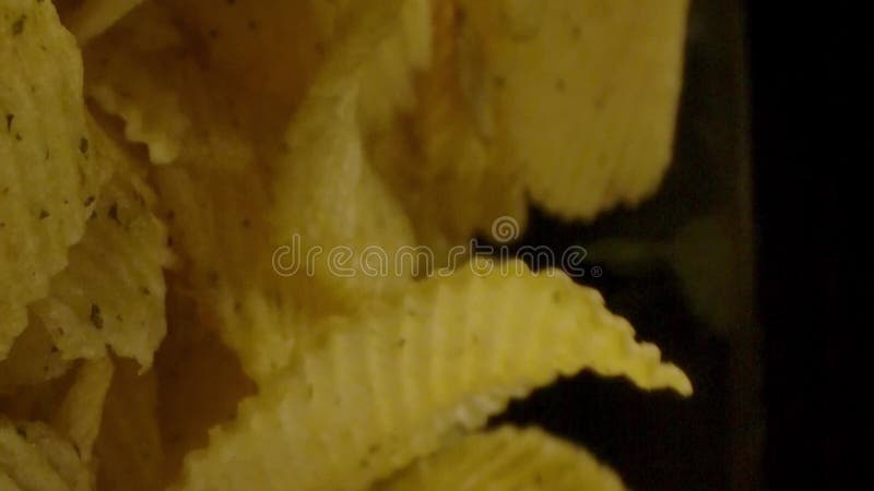 Vertical of Ribbed Chips Falling into Bowl. Stock Video - Video of food ...