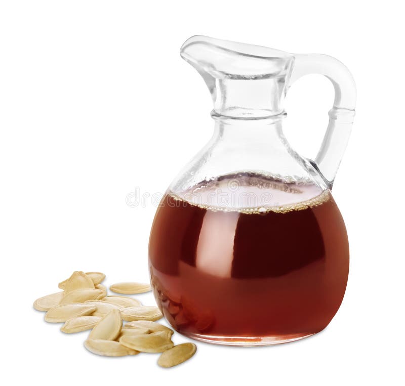 Fresh Pumpkin Seed Oil in Glass Jug and Kernels Isolated on White Stock ...