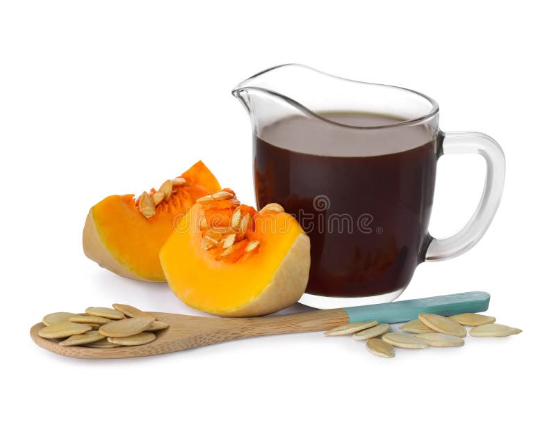 Fresh Pumpkin Seed Oil in Glass Pitcher Isolated on White Stock Image ...