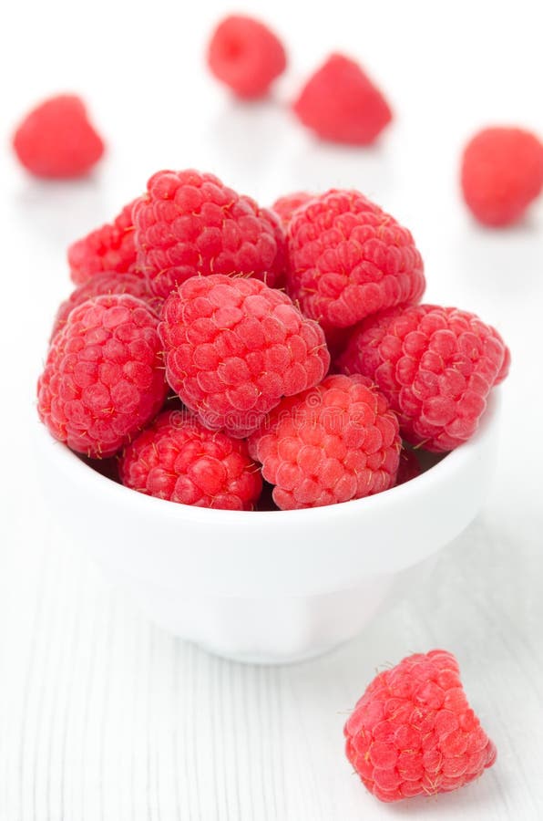 Fresh Raspberries in a Bowl, Vertical Close-up Stock Photo - Image of ...