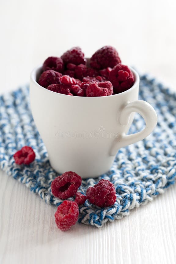 Fresh raspberries in cup stock photo. Image of white - 27634766