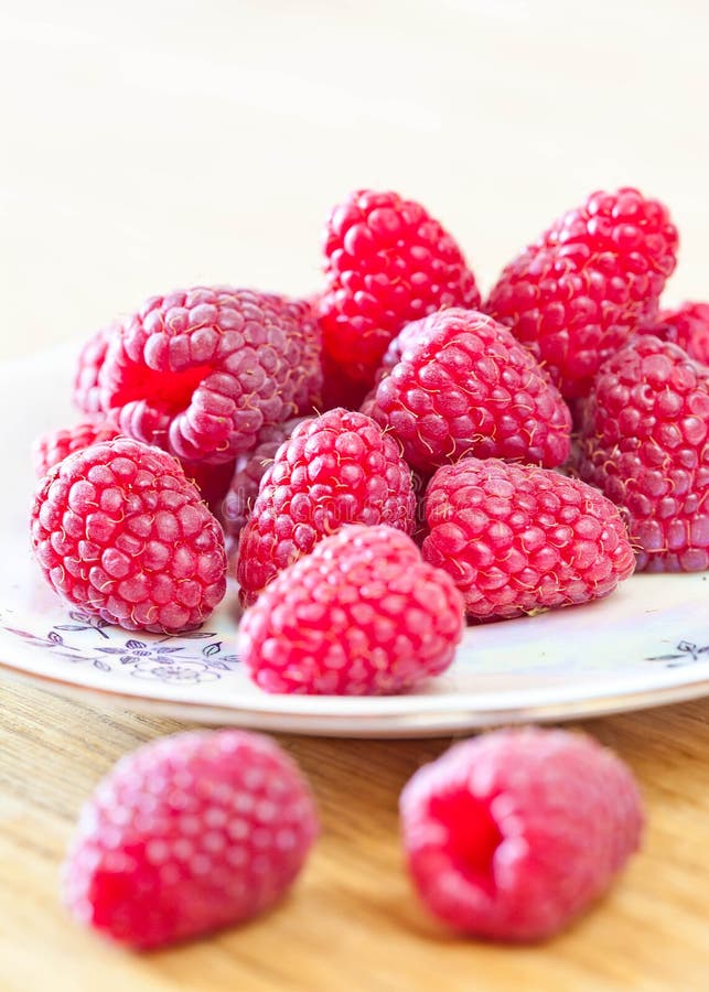 Fresh Raspberries in a Plate on the Table Stock Photo - Image of table ...