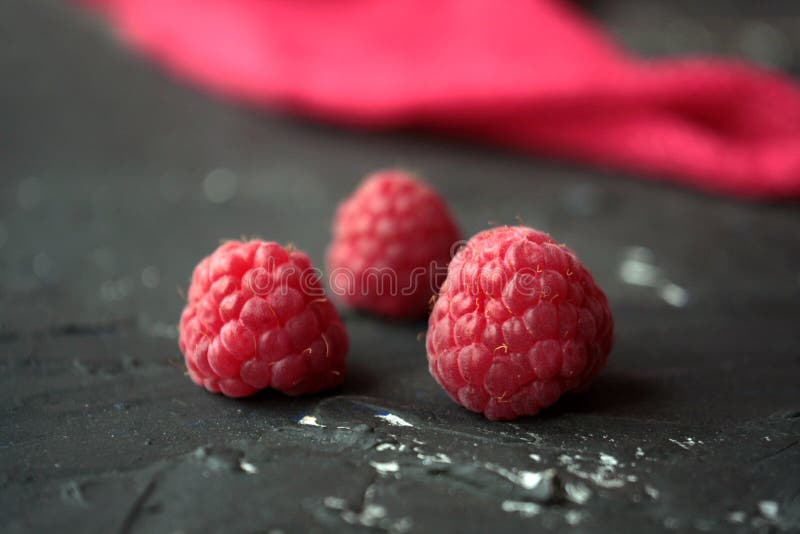 Fresh Raspberry Set with Pink Napkin on Black Background Stock Image ...
