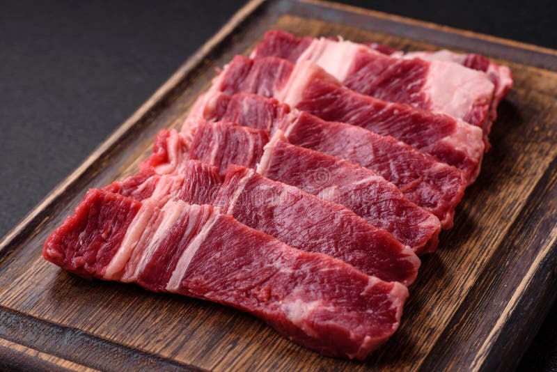 Fresh Raw Beef Cut into Slices with Salt, Spices Stock Photo - Image of ...