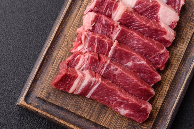 Fresh Raw Beef Cut into Slices with Salt, Spices Stock Photo - Image of ...