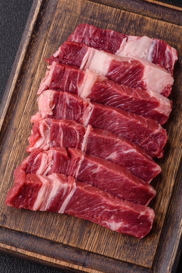 Fresh Raw Beef Cut into Slices with Salt, Spices Stock Photo - Image of ...