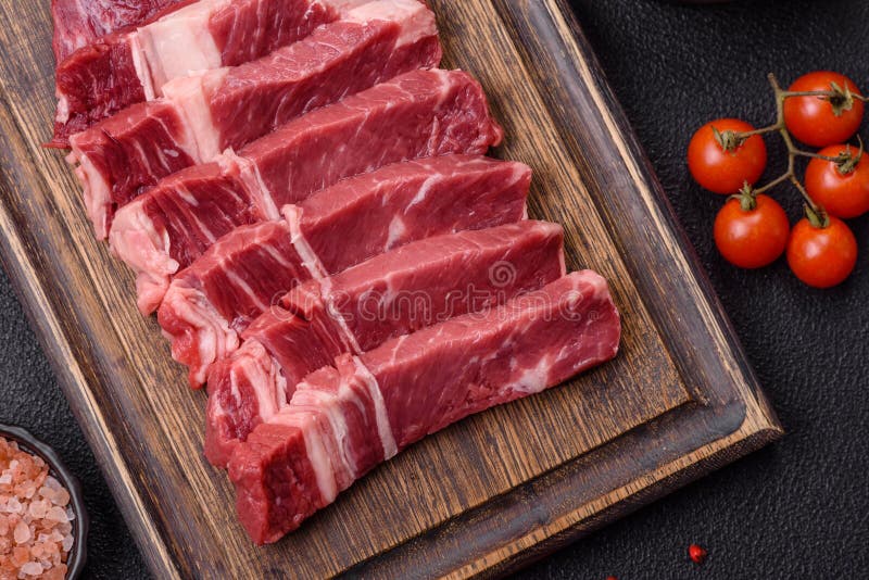 Fresh Raw Beef Cut into Slices with Salt, Spices Stock Photo - Image of ...